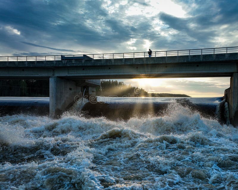Scenic View of a Bridge Spanning a River with Rippling Waves Below ...