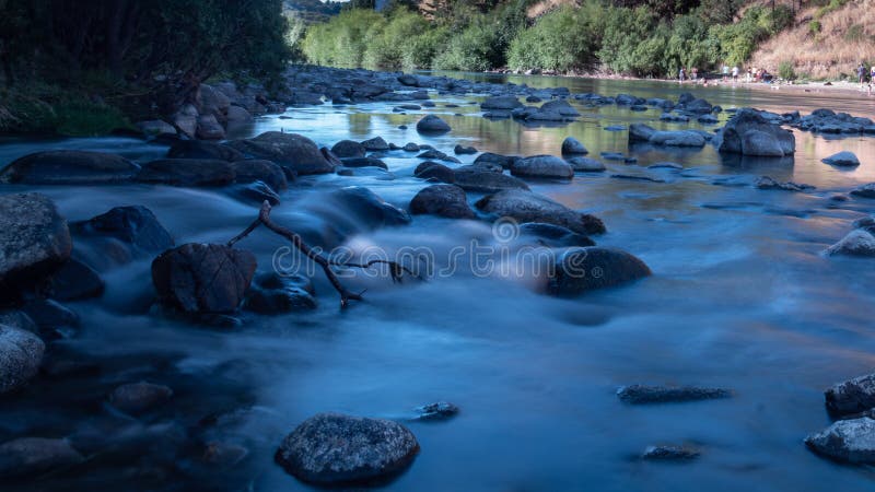 Scenic View of the Flow of a River with Trees Alongside Stock Photo ...