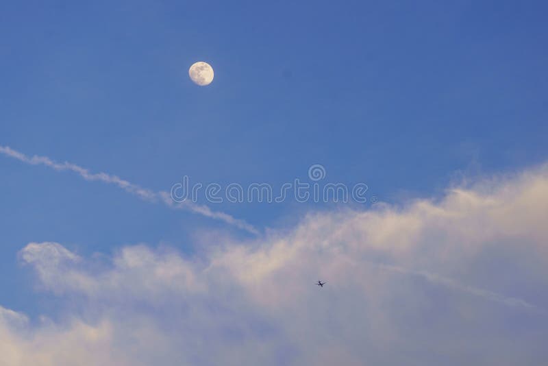 Scenic View of the Full Moon in the Blue Sky Covered in White Puffy ...