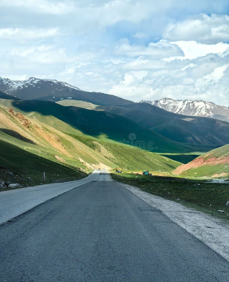 Scenic View of a Long and Winding Open Highway Surrounded by Snow ...