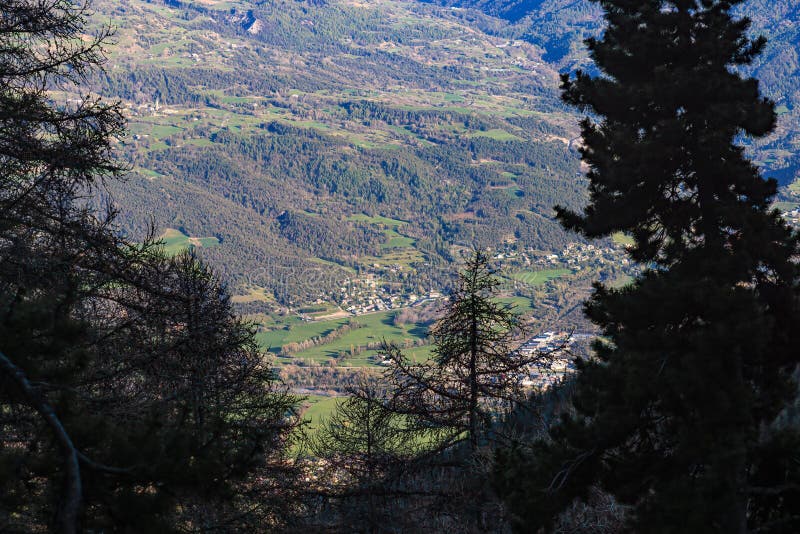 A Scenic View of a Moutain Village Accross Pine Trees Stock Photo ...