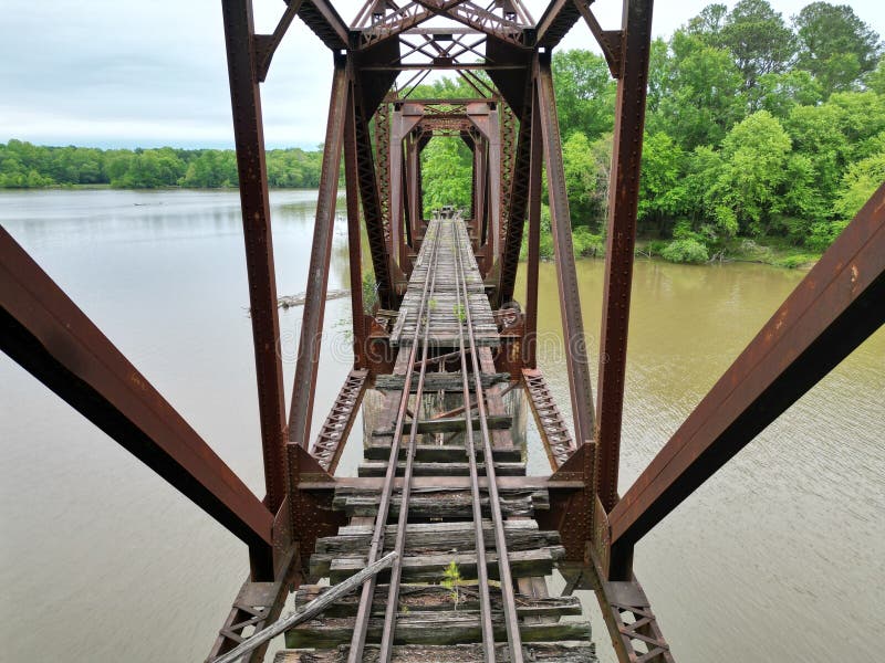 Scenic View of a Railroad Bridge, Spanning Across a Peaceful Lake Stock ...