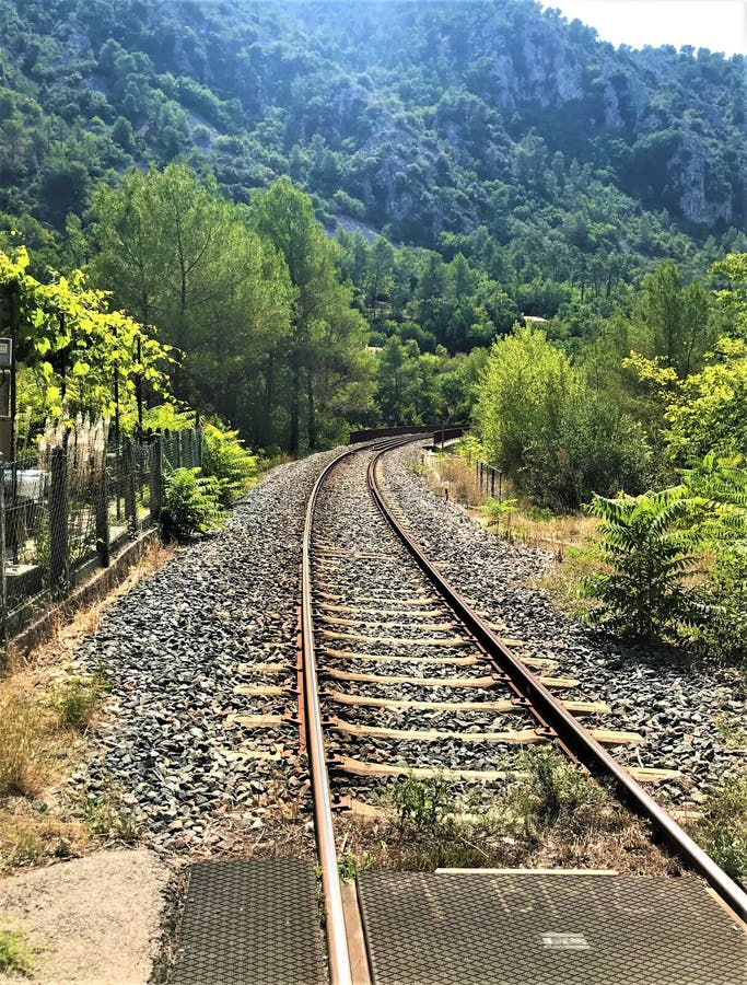 Railroad Tracks in Scenic Nature Stock Image - Image of mountains, tree ...