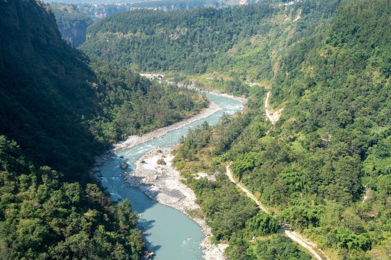 Scenic View of a River Running through a Lush Canyon Surrounded by ...
