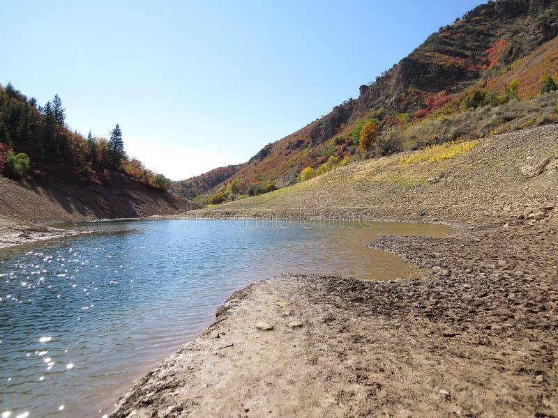 Scenic View of a Riverfront with a Mountain Backdrop in the Fall in ...