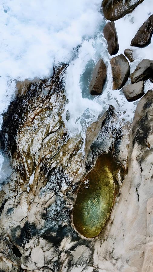 Scenic View of a Sea Surrounded by Jagged Rocks Stock Photo - Image of ...