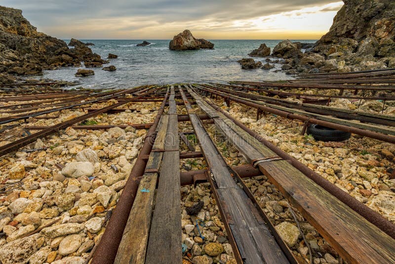 Shore with Rails for Transporting Boats and Big Rocks Stock Image ...