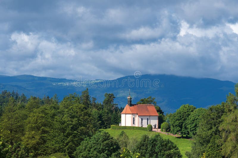 Scenic View of a Small Church on a Hill Surrounded by Lush Greenery ...