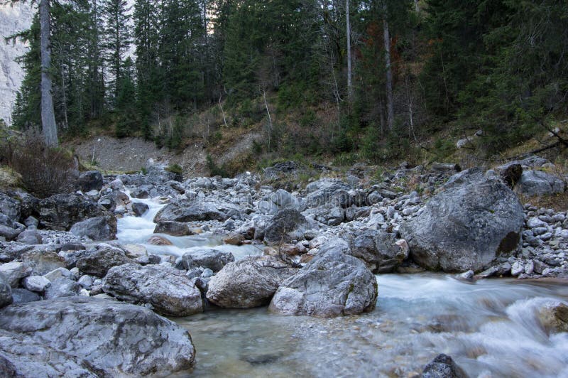 Scenic View of a Stream Flowing through Stones in the Forest - Perfect ...
