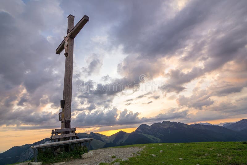 Scenic View of Summit Cross Under a Spectacular Evening Sky with Clouds ...