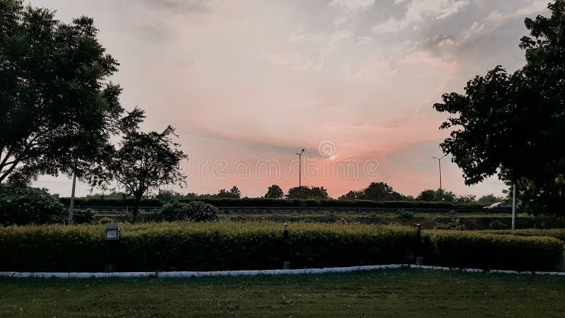 Scenic View while Sunset with Greenery. Stock Photo - Image of ...