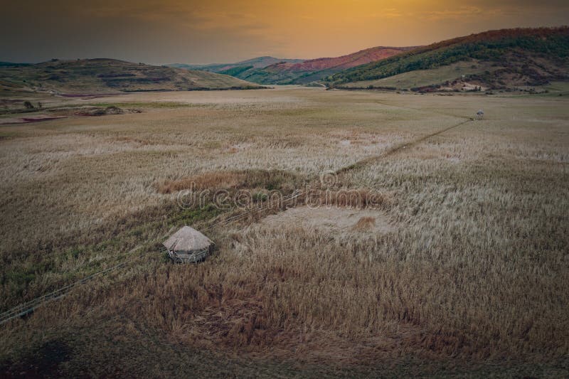 Scenic View of Sunset Over a Grassy Plain Field Stock Photo - Image of ...