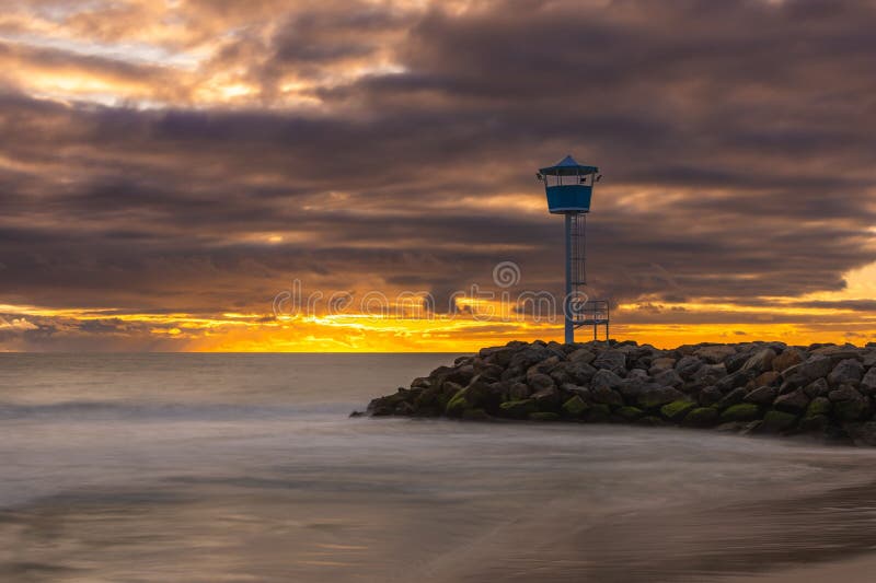 Scenic View of a Watching Tower on the Beach at a Cloudy Sunset Stock ...