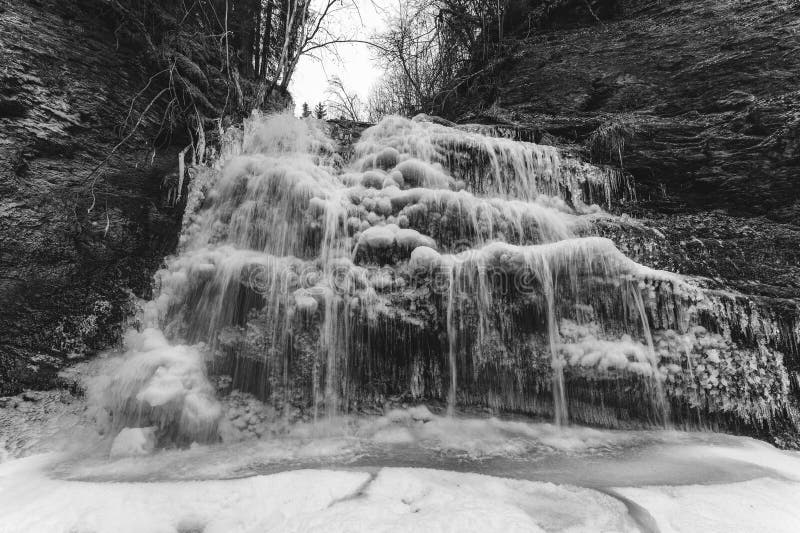Scenic View of a Waterfall Cascading Down the Rocks in Grayscale Stock ...