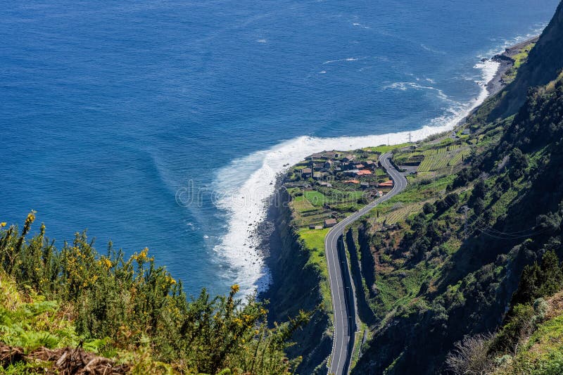 Scenic View of a Winding Road Along a Steep Cliffside Overlooking the ...