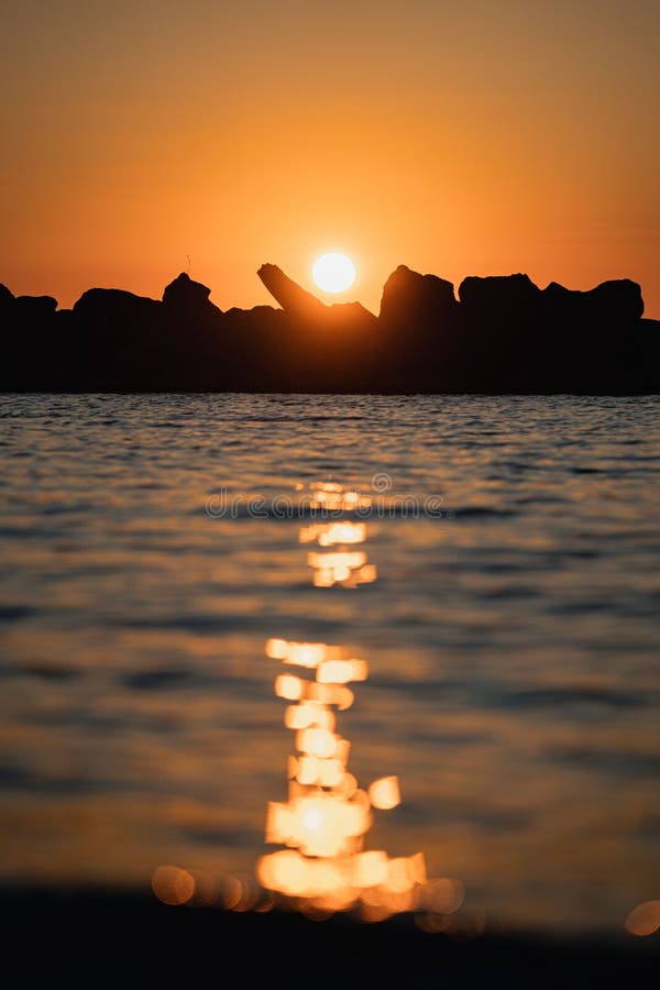 Scenic Vivid Sunset Sky Over the Ocean Stock Photo - Image of vertical ...