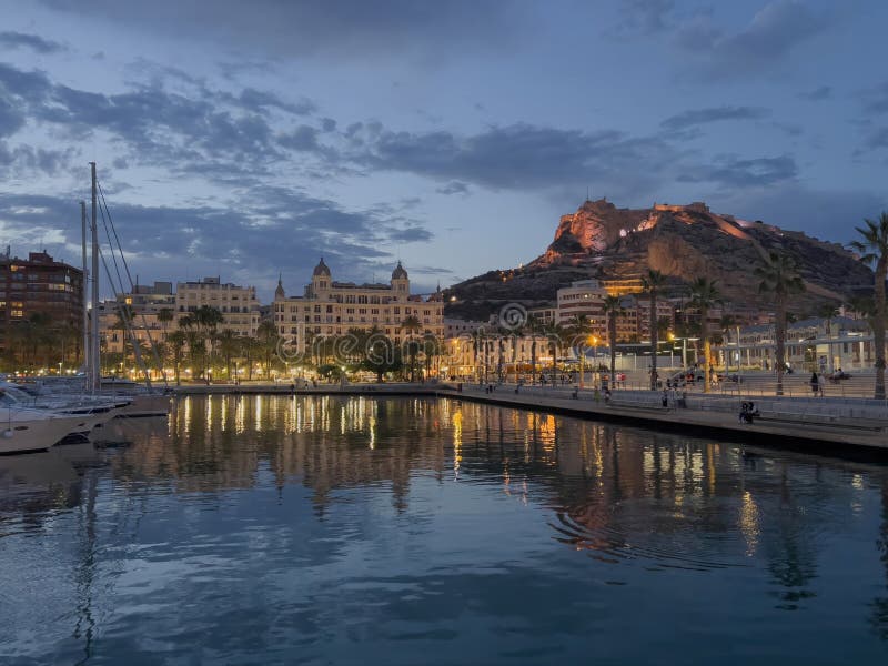 Scenic Waterfront Cityscape at Twilight with Illuminated Buildings ...