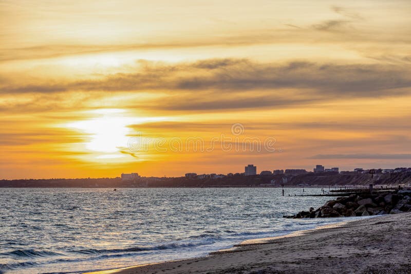 A Scenics View of a Beautiful Sunset Along a Beach with City Building ...