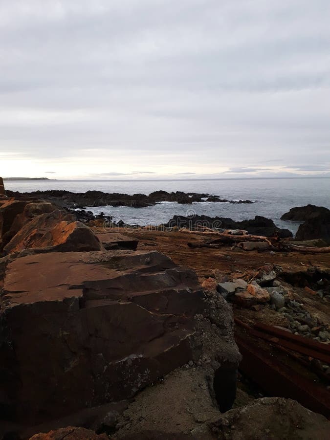 Scenic View of the Beach and Cloudy Sky Against Stock Photo - Image of ...