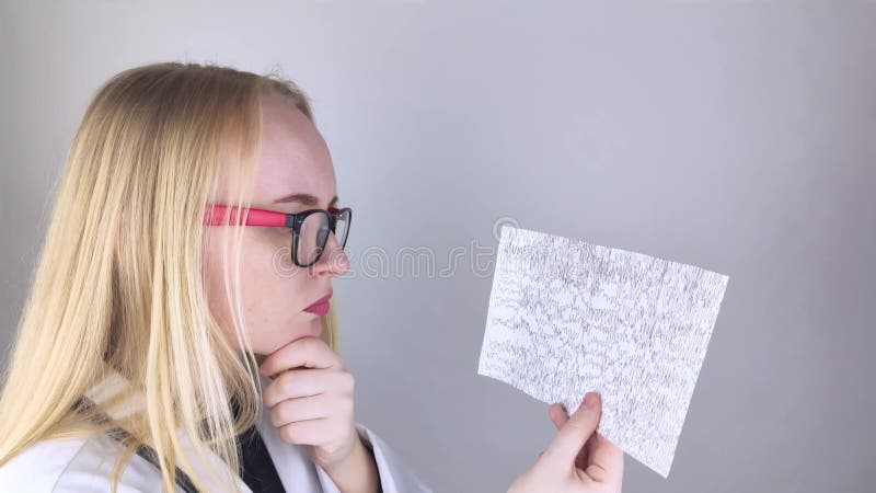 A Neurologist Examines an Encephalogram of a Patientâ€™s Brain ...