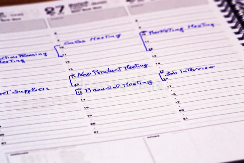Scheduling Meeting Time on a Notepad To Fix a Business Meeting Stock ...