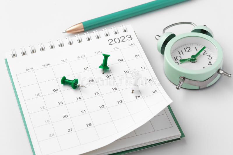 Scheduling and Planning Concept, Calendar with Green Pin, Pen and Clock ...
