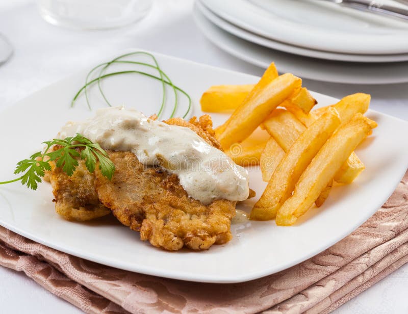 Schnitzel with Cheese Sauce Stock Photo - Image of chicken, beer: 81342080