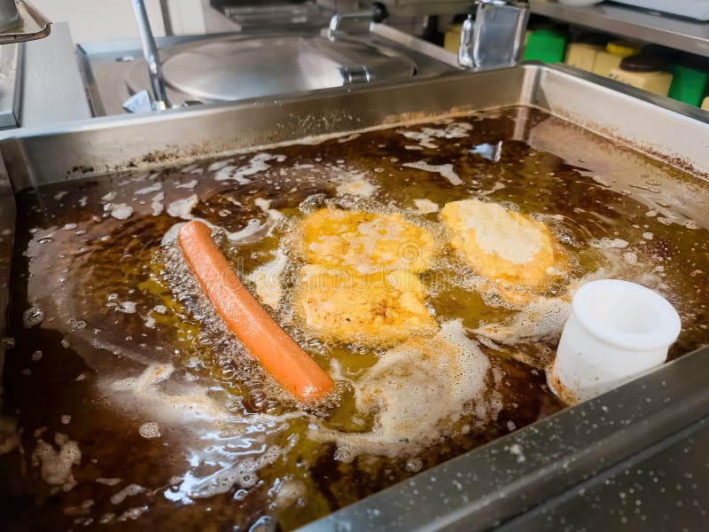 Schnitzel and Sausage are Fried in the Kitchen of a Restaurant Stock ...