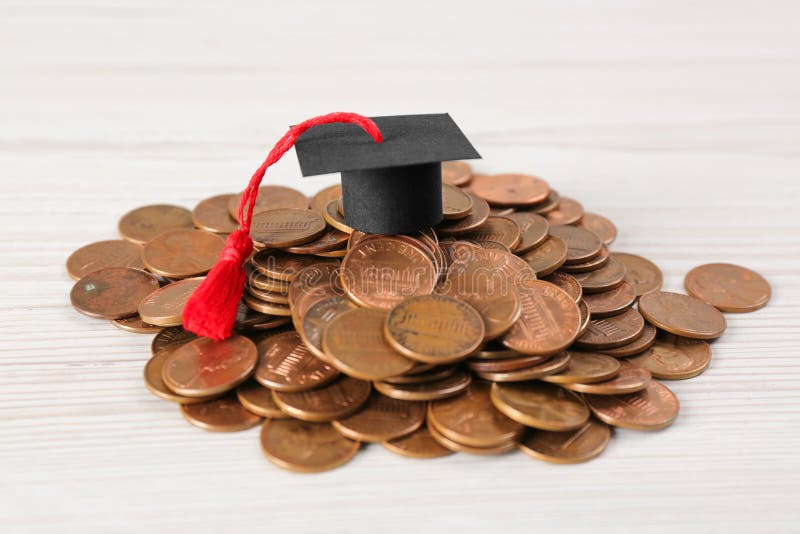 Scholarship Concept. Graduation Cap and Coins on White Wooden Table ...