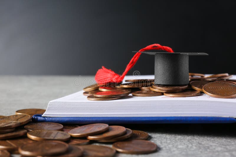 Scholarship Concept. Graduation Cap, Notebook and Coins on Light Grey ...