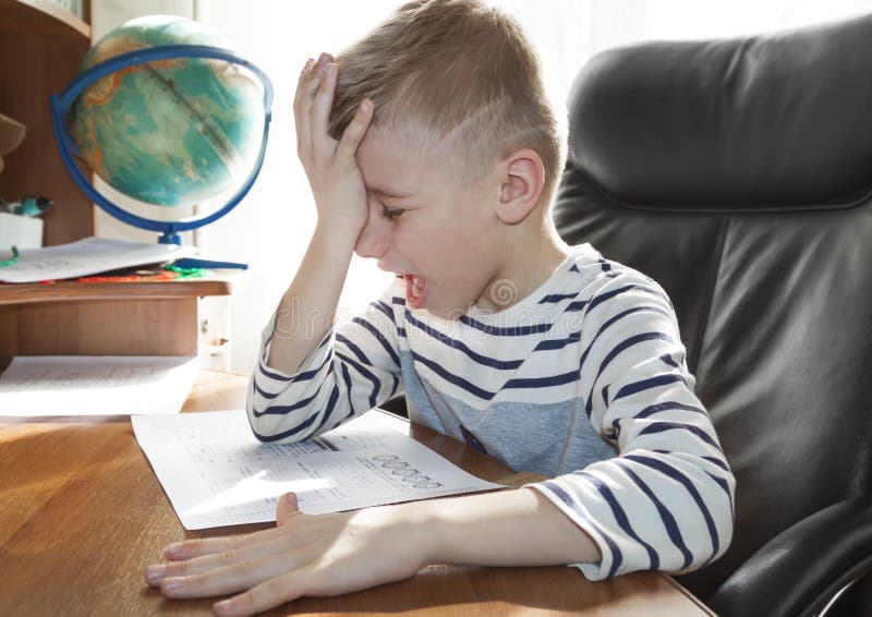 School-age Boy Crying and Screaming while Doing Homework. the Concept ...