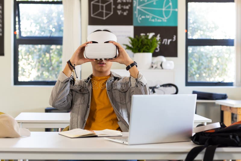 In School, Asian Teenage Boy Using VR Headset while Studying with ...