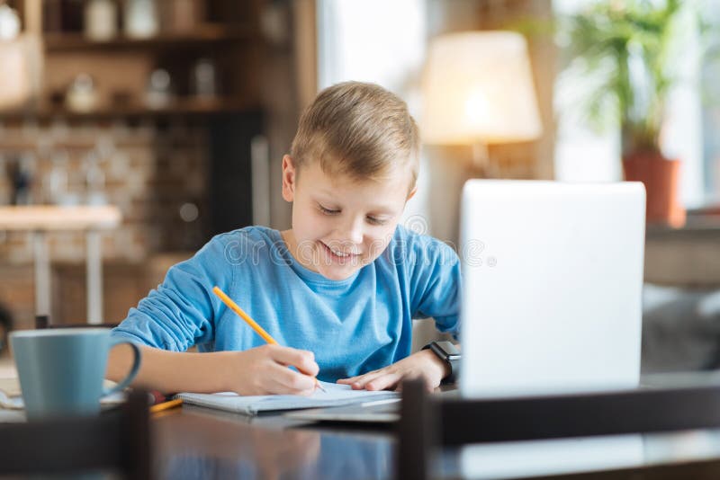 Positive Smart Boy Doing His Home Task Stock Photo - Image of notes ...