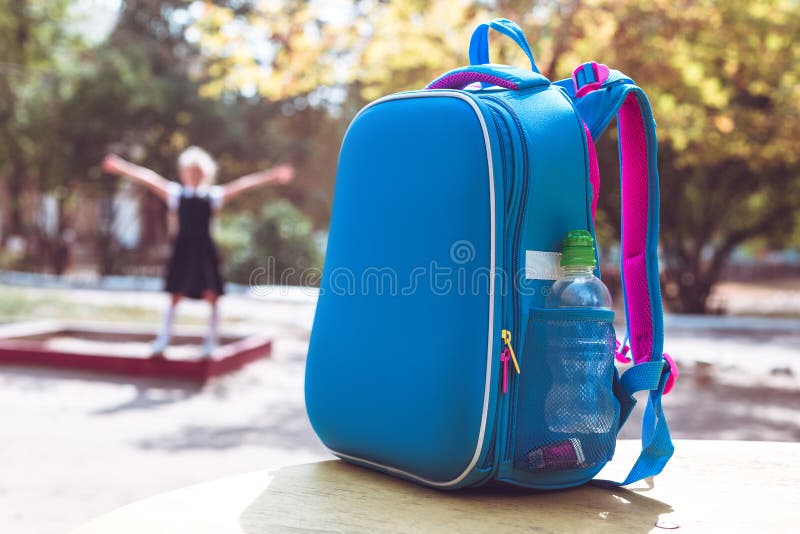 School Bag and an Elementary Student on Playground Stock Photo - Image ...