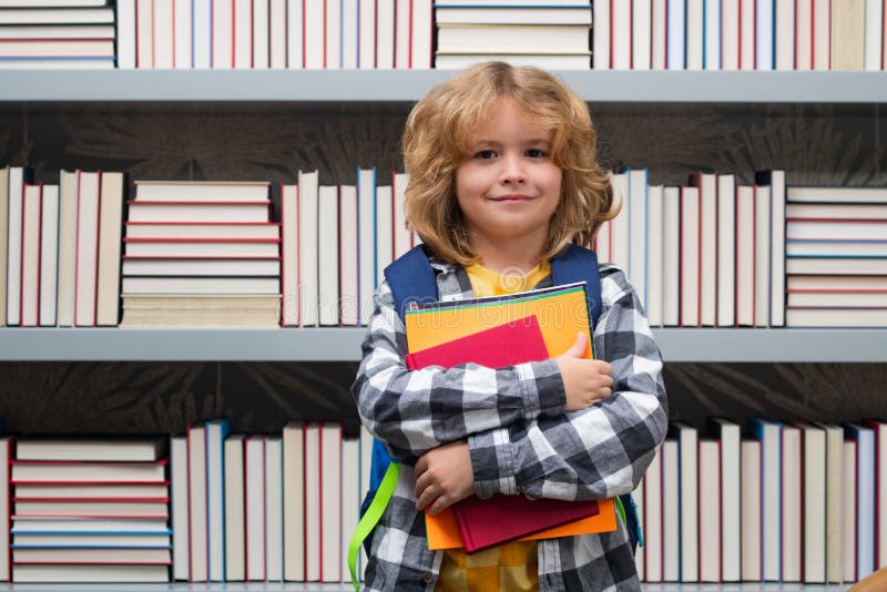 School Boy with Books in Library. Back To School. Funny Little Child ...