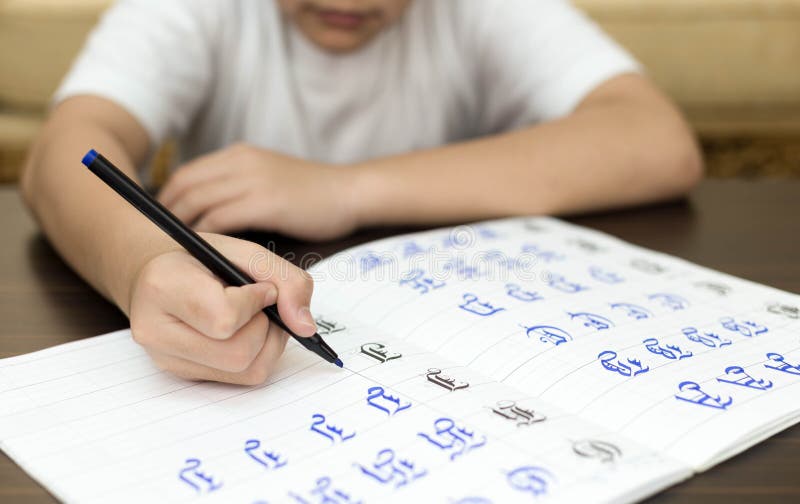 School Boy Doing Home Work Hand Writing Answers an Excercise Stock ...