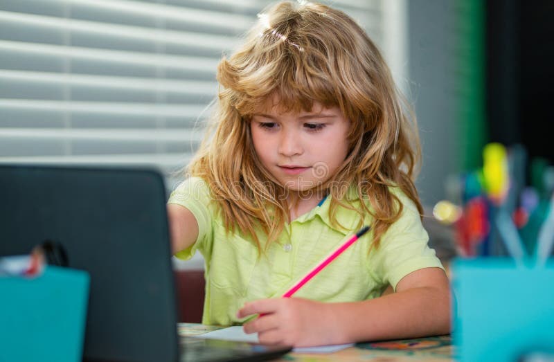 School Boy Doing Homework Writing and Reading at Home. Concentrated ...