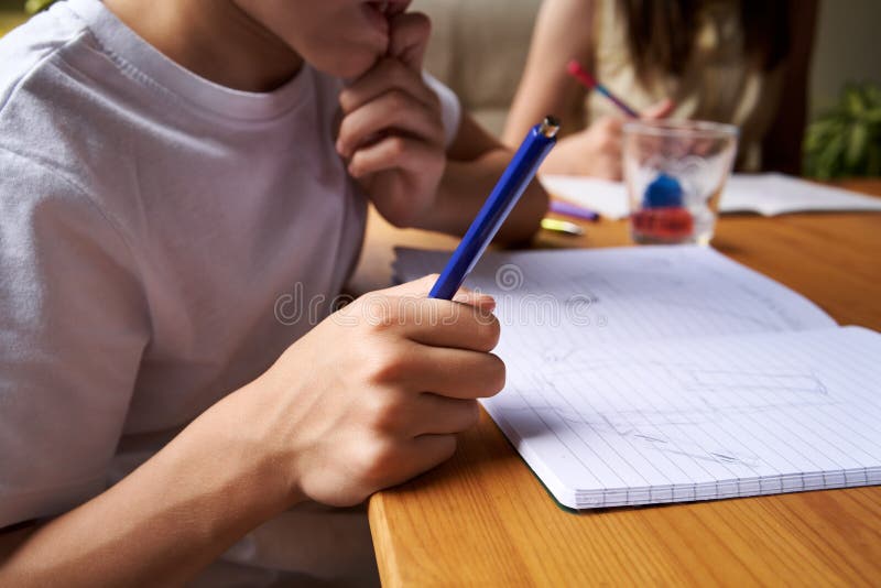 School Boy Drawing into Exercise Book, Doing Homework Stock Image ...