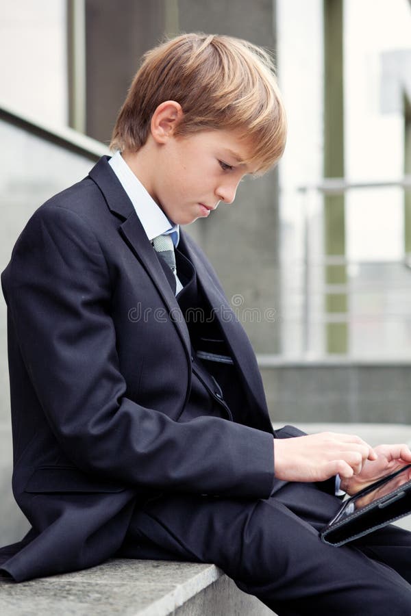 School Boy with Electronic Tablet Sitting, Stock Photo - Image of ...