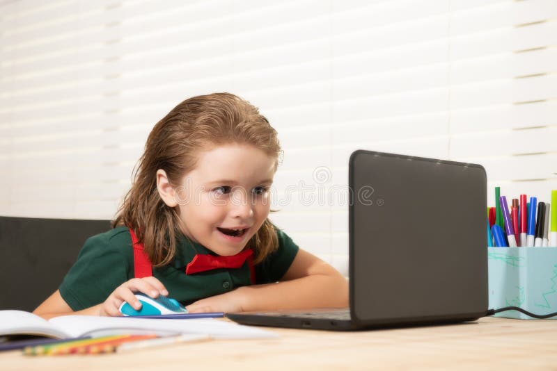 School Boy with a Happy Smiling Face Studying and Using Computer Laptop ...