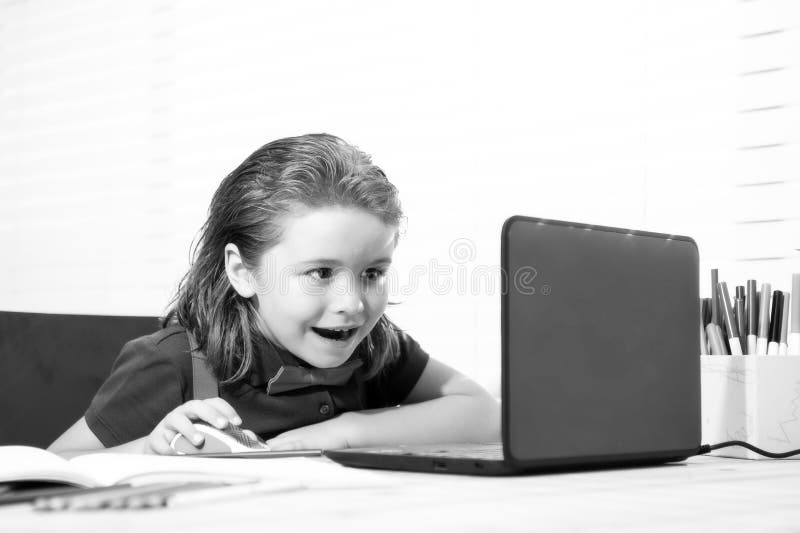 School Boy with a Happy Smiling Face Studying and Using Computer Laptop ...