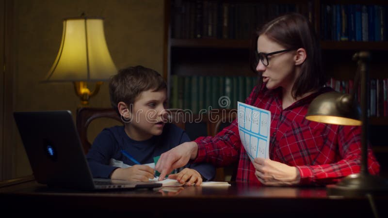 School Boy Making Math Homework with Young 30s Mother at Home. Kid ...