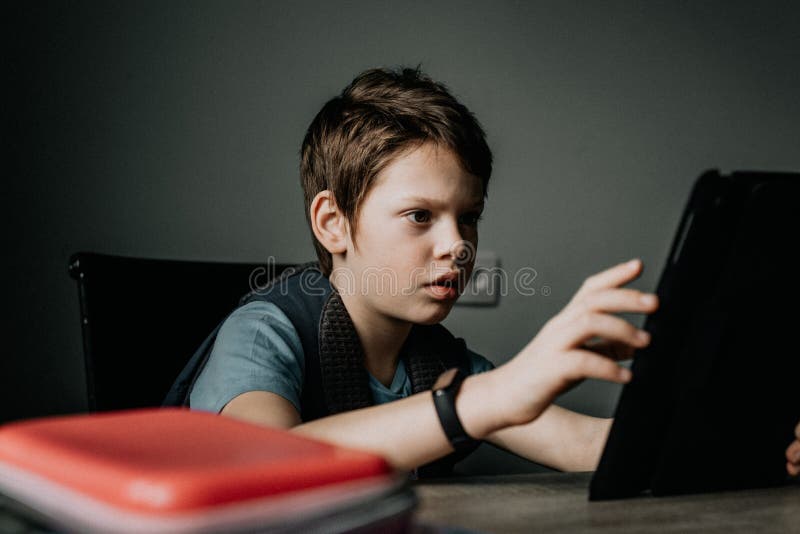 School Boy Playing Tablet at Home, Growing Up with Technology Stock ...