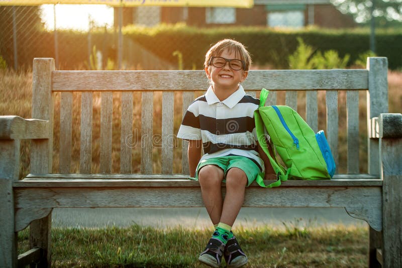 School Boy Sitting on Bench with His Backpack in Park Primary School ...