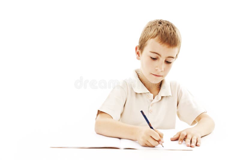 Student Writing in Notebook in School Classroom Stock Image - Image of ...