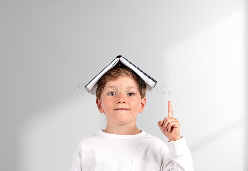 School Boy Smiling with Finger Pointing Up, Empty White Background ...