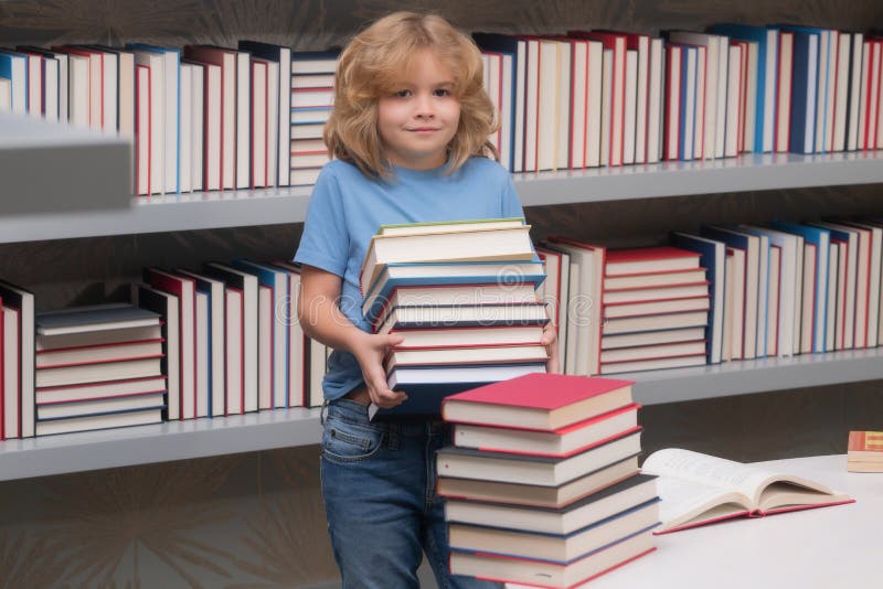 School Boy with Stack of Books in Library. School Child Student ...