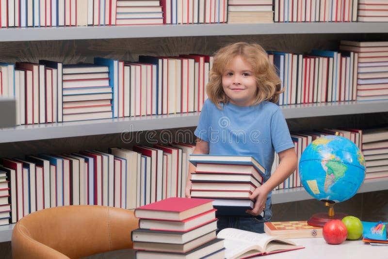 School Boy with Stack of Books in Library. School Kid Student Learning ...