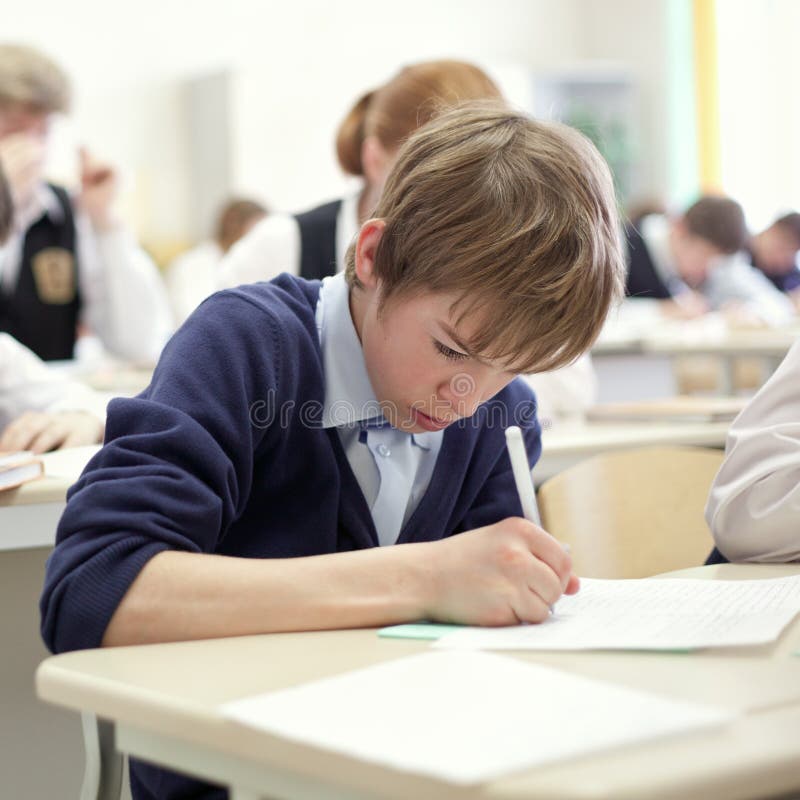 School Boy Struggling To Finish Test in Class. Stock Photo - Image of ...