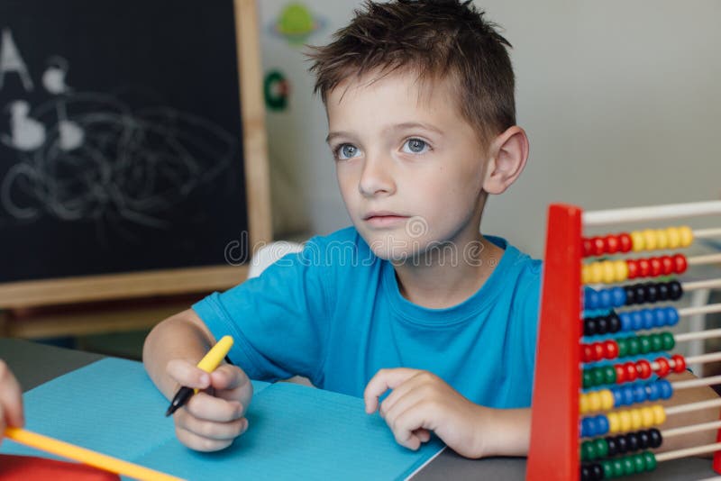 Portrait of a School Boy Working on Math Homework Stock Photo - Image ... Portrait of a School Boy Working on Math Homework Stock Photo - Image ...